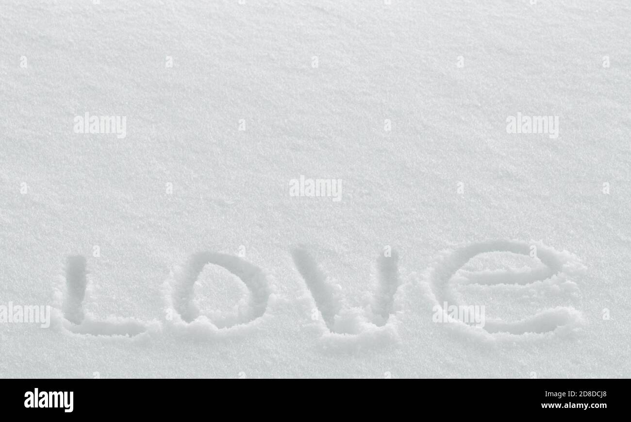 Word love drawing on snow surface, valentine's day greeting card ...
