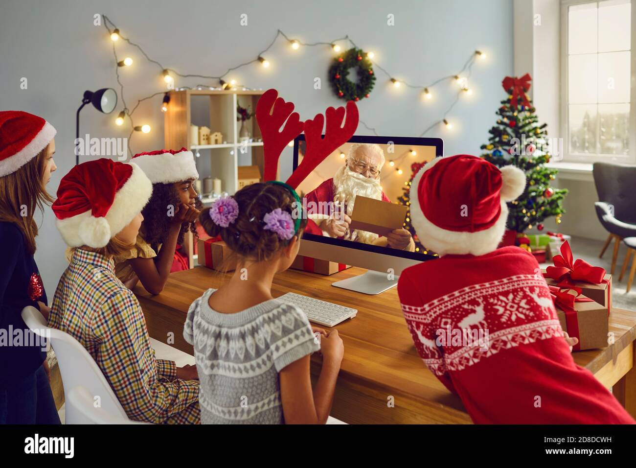 Kids having a video call with Santa and listening to the names from the ...