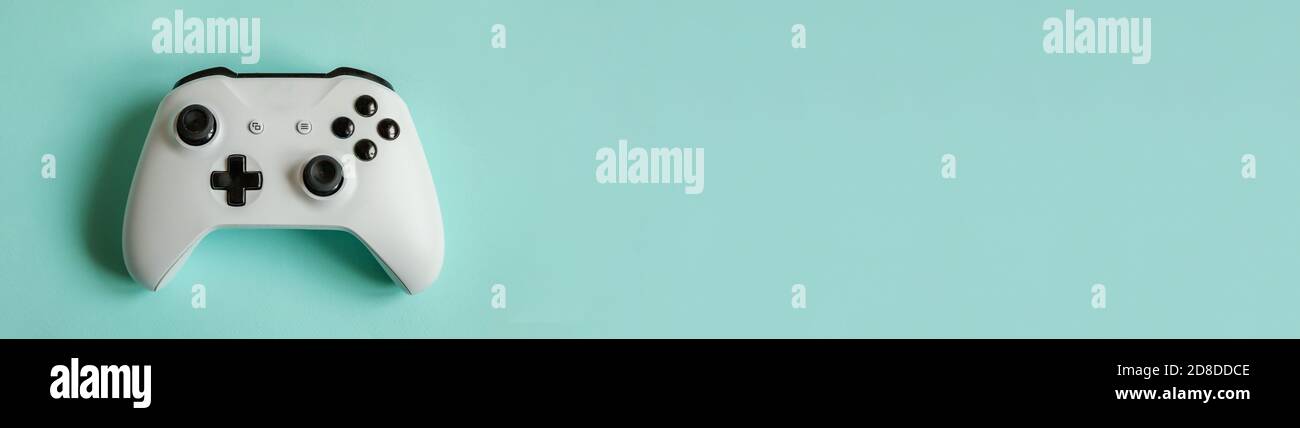 White Joystick Gamepad Game Console Isolated On Pastel Blue Colourful