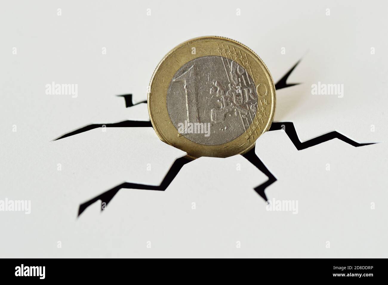 Euro coin in cracked ground - Crash of euro concept Stock Photo - Alamy