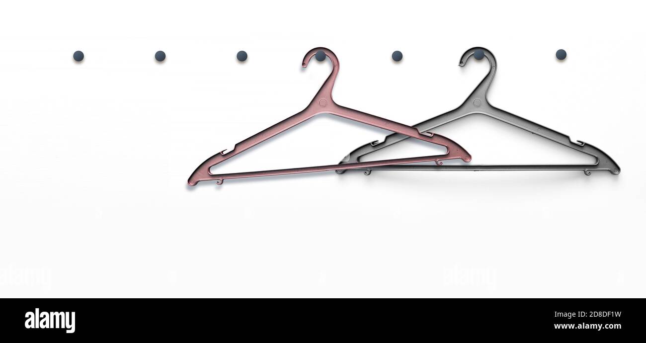 Two white wooden hanger without clothes on background of white wall ...