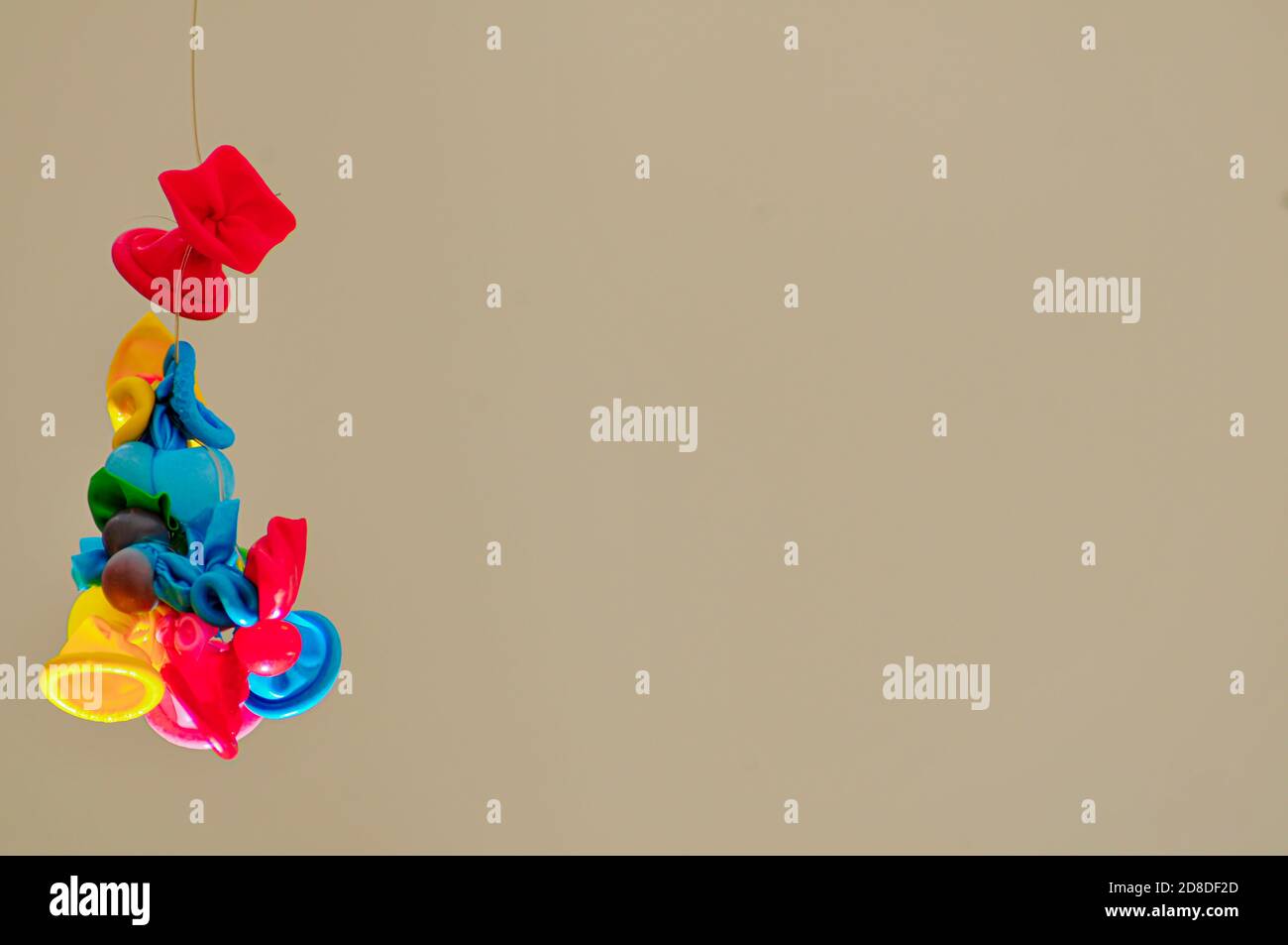 Pop balloons on a creamy background Stock Photo - Alamy