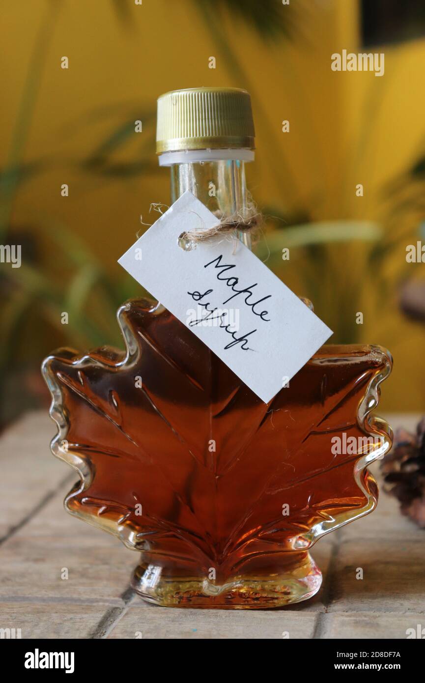 Maple syrup in a maple leaf shaped bottle,with handwritten tag/Canada ...