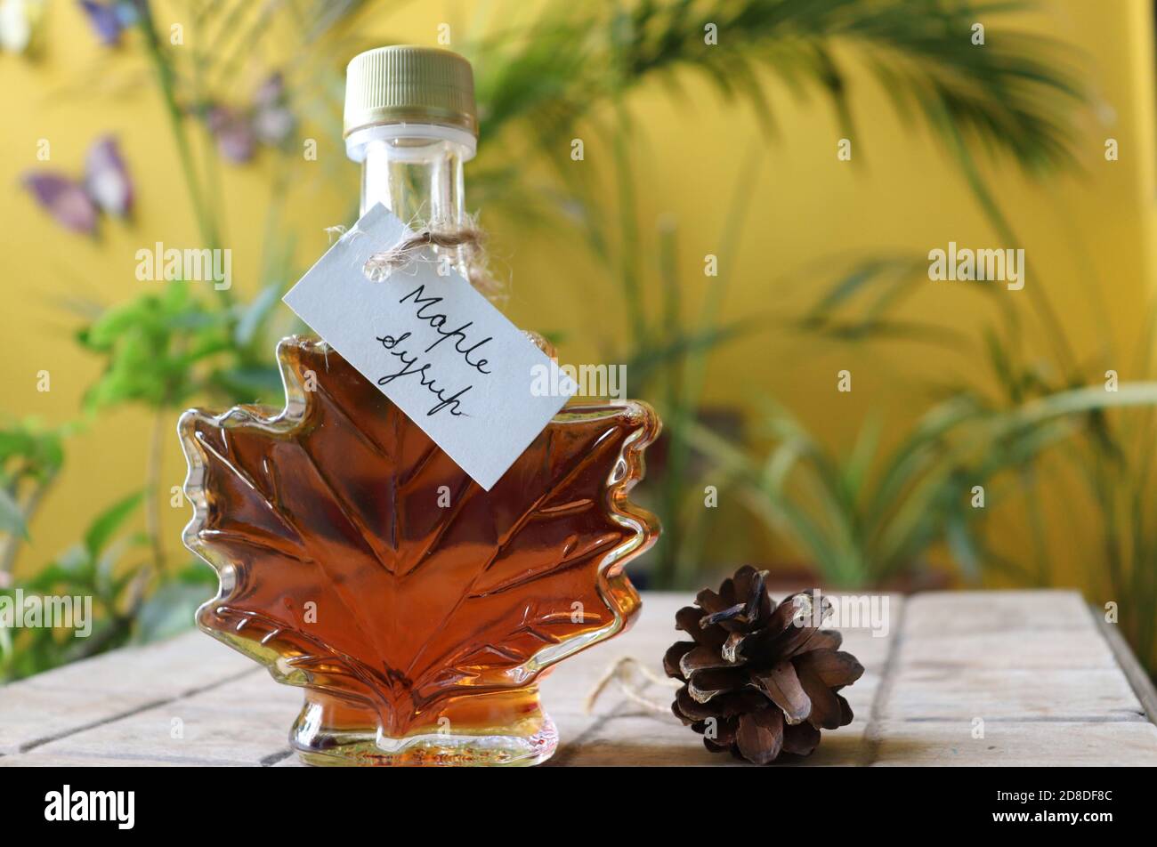 Maple syrup in a maple leaf shaped bottle,with handwritten tag/Canada ...