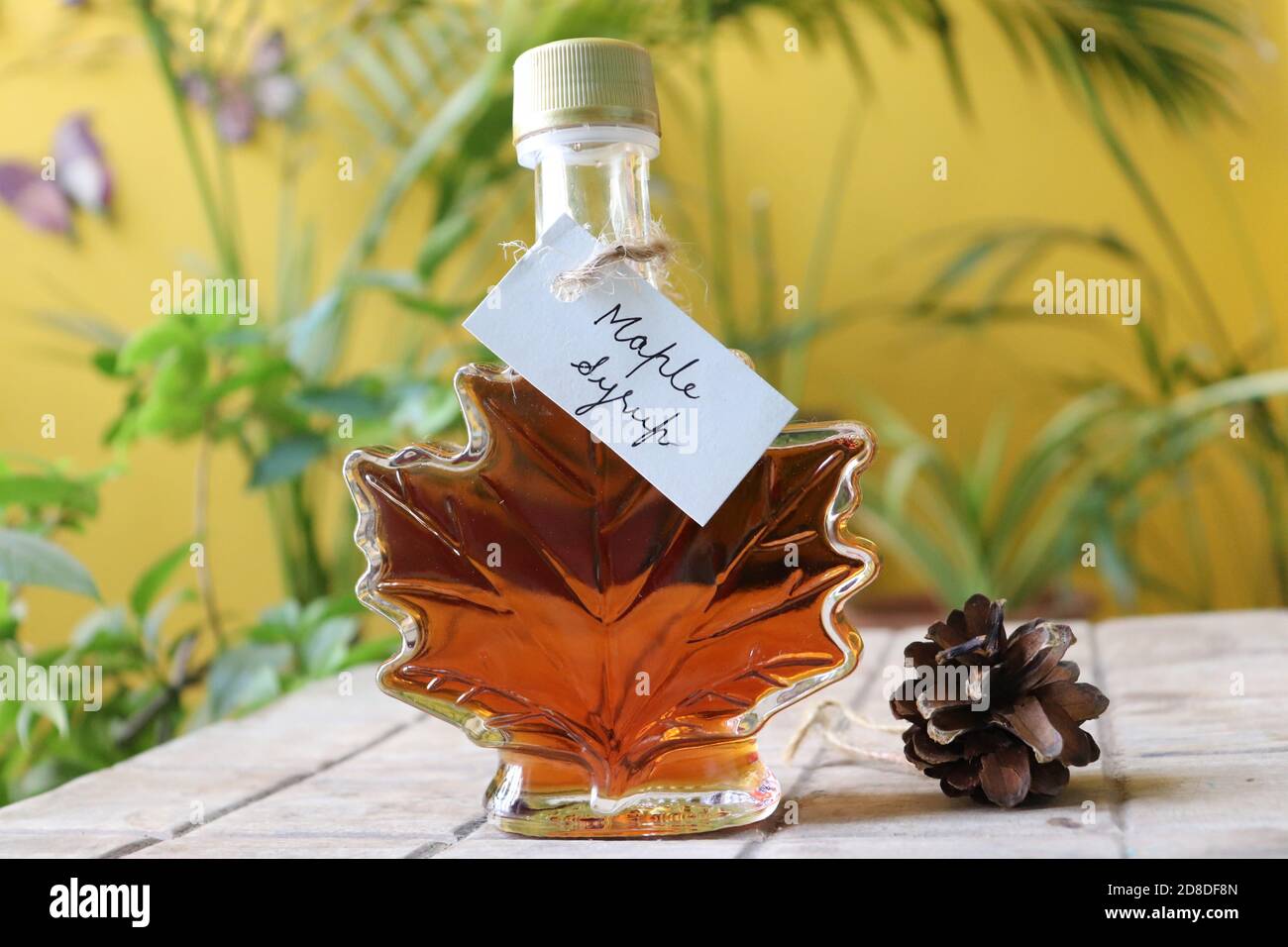 Maple syrup in a maple leaf shaped bottle,with handwritten tag/Canada ...