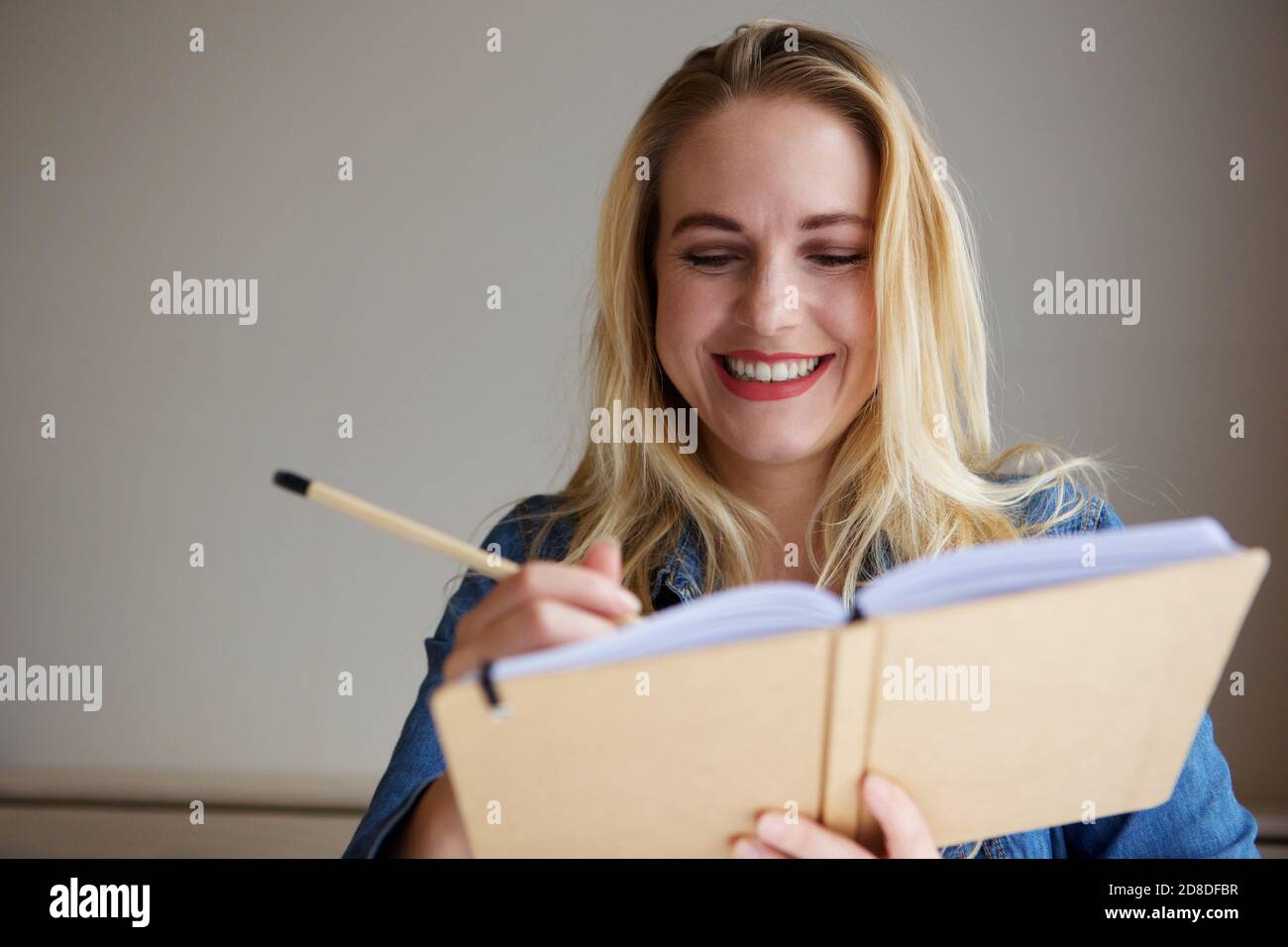 Woman thinking with pen pencil hi-res stock photography and images - Alamy