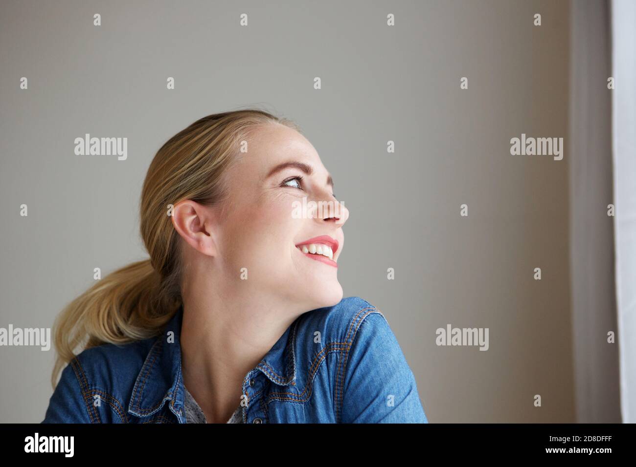 Side portrait cheerful young hi-res stock photography and images - Alamy