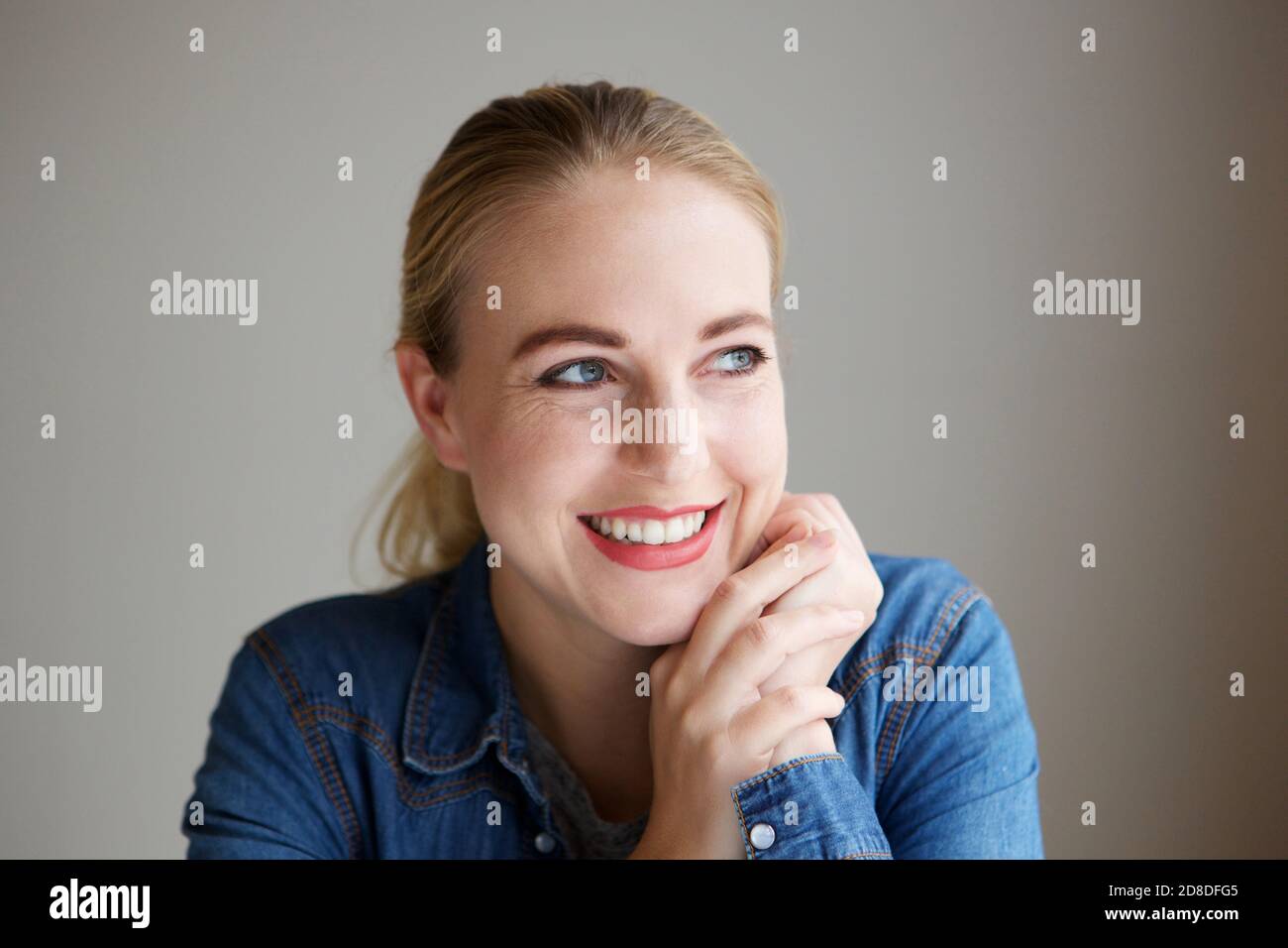 Happy woman sitting blond hi-res stock photography and images - Alamy