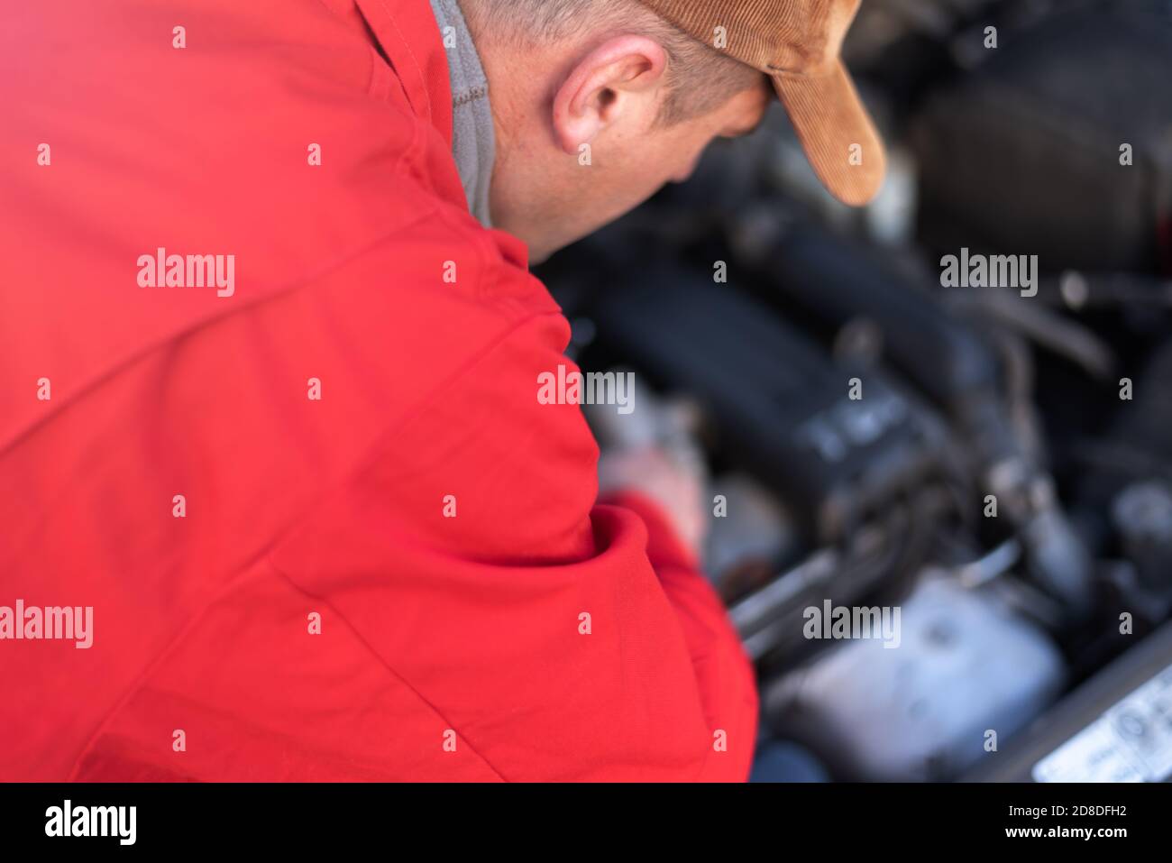 Emergency roadside assistance, road assistance worker in uniform trying ...