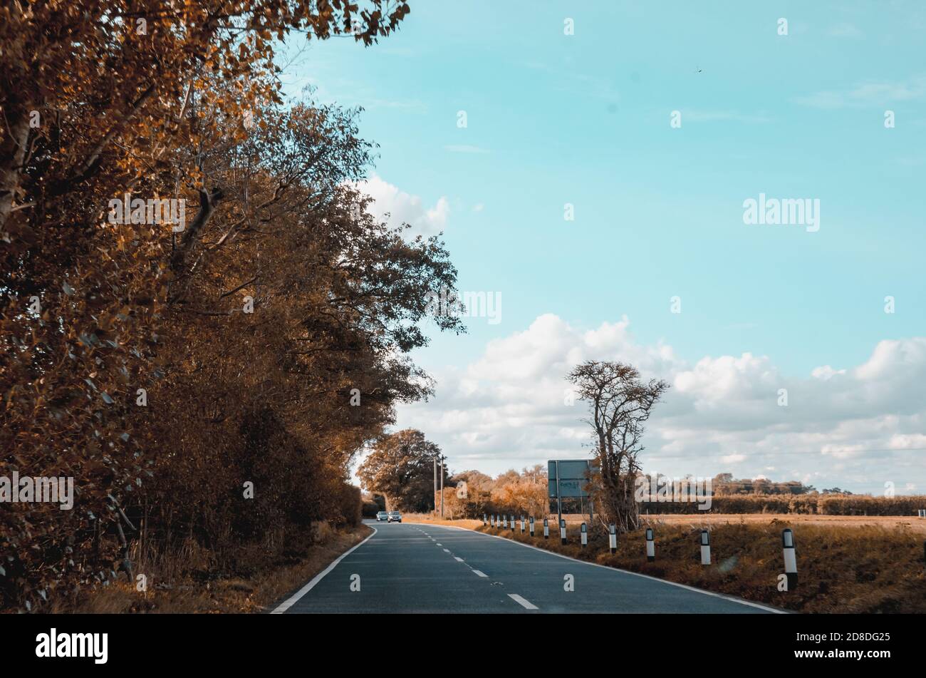 Country side two lanes road in autumn Stock Photo - Alamy