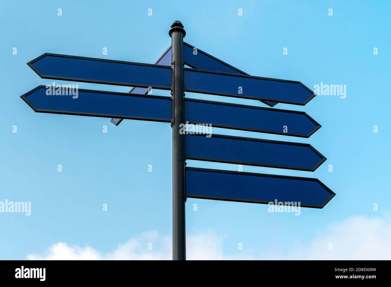 Blue Blank directional Signs over cloudy Sky Stock Photo - Alamy
