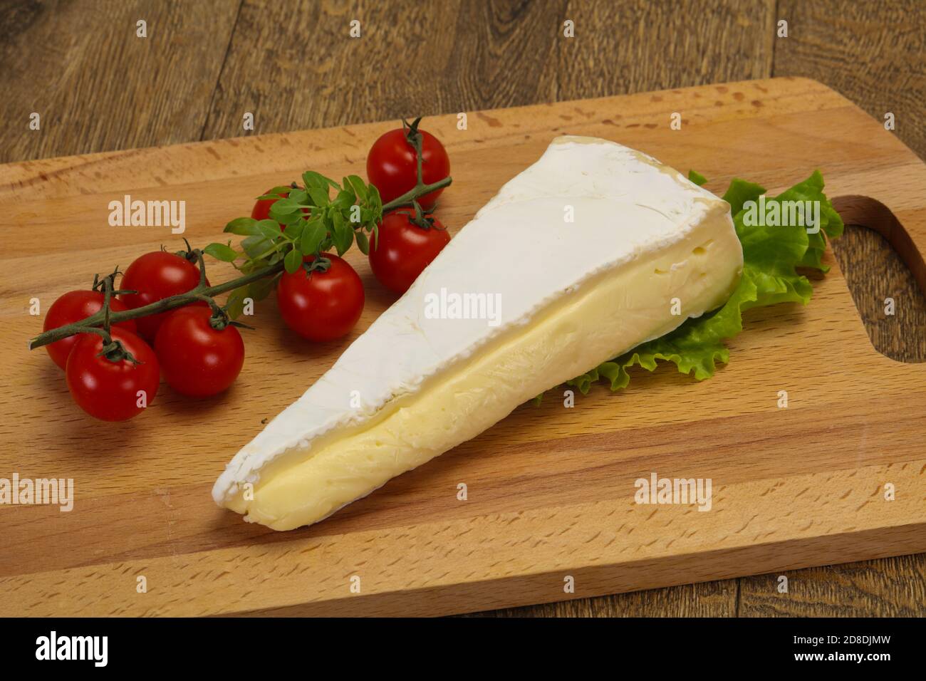 Brie cheese triangle served salad leaves Stock Photo - Alamy