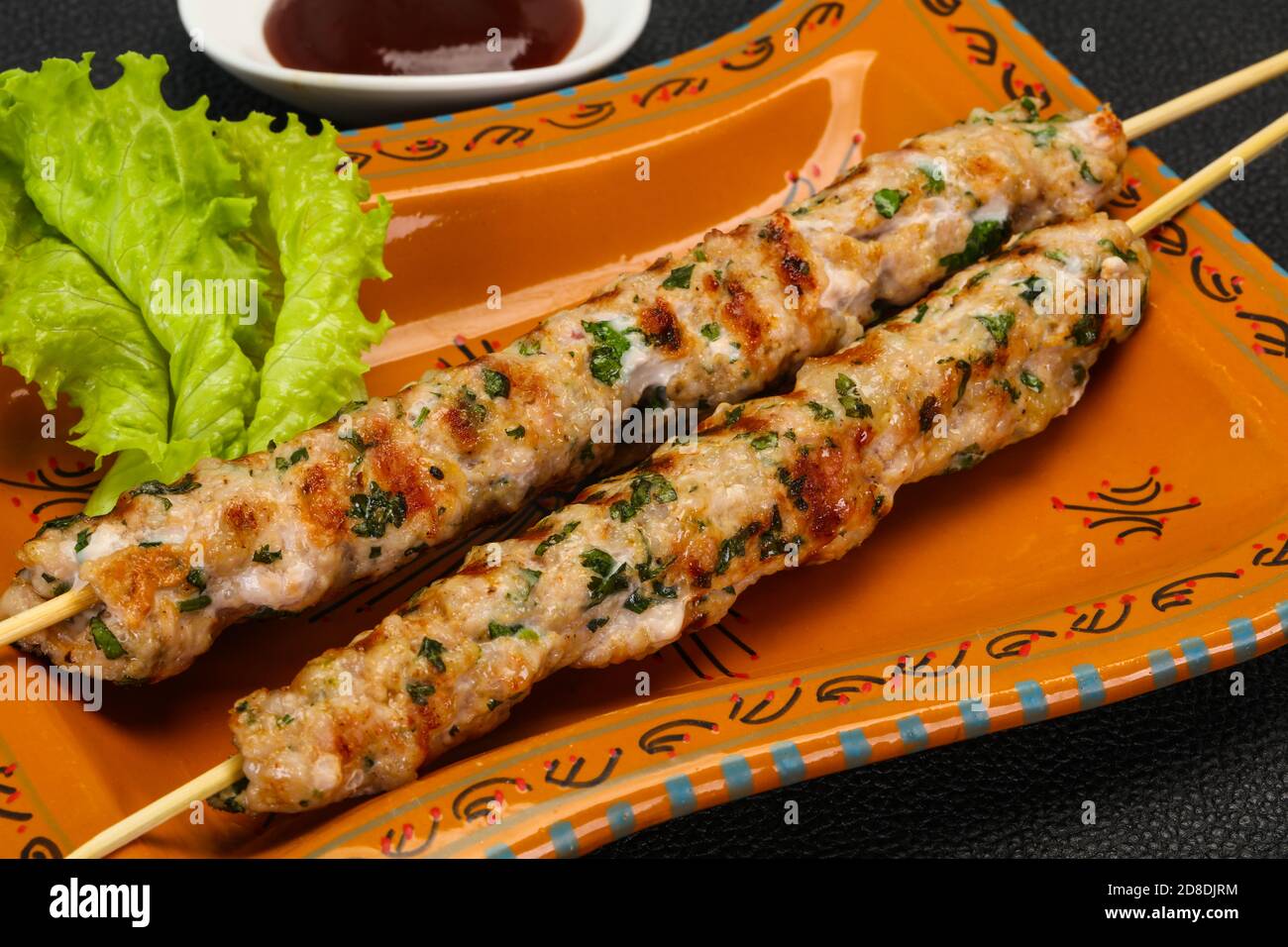 Minced pork skewer kebab with bbq sauce Stock Photo - Alamy