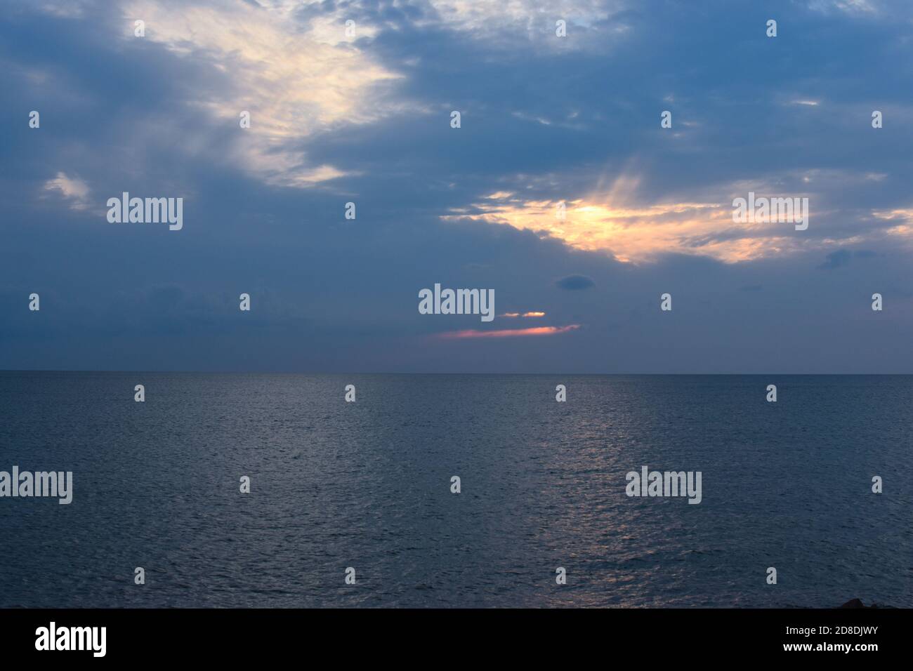 Sunset Bay Beach at dusk Stock Photo - Alamy