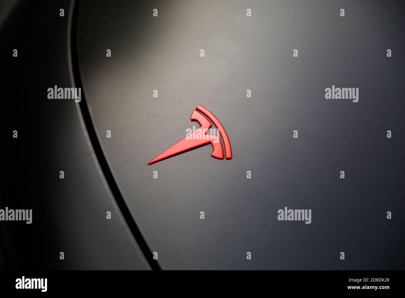 Tesla's logo on its car in London. Tesla is an American electric car ...