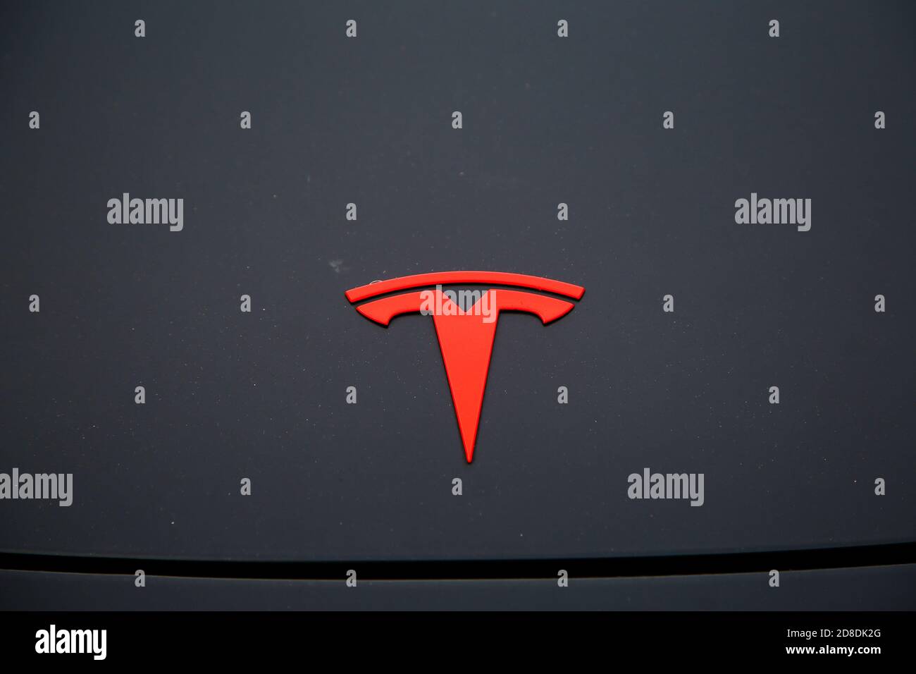 Tesla's logo on its car in London. Tesla is an American electric car ...