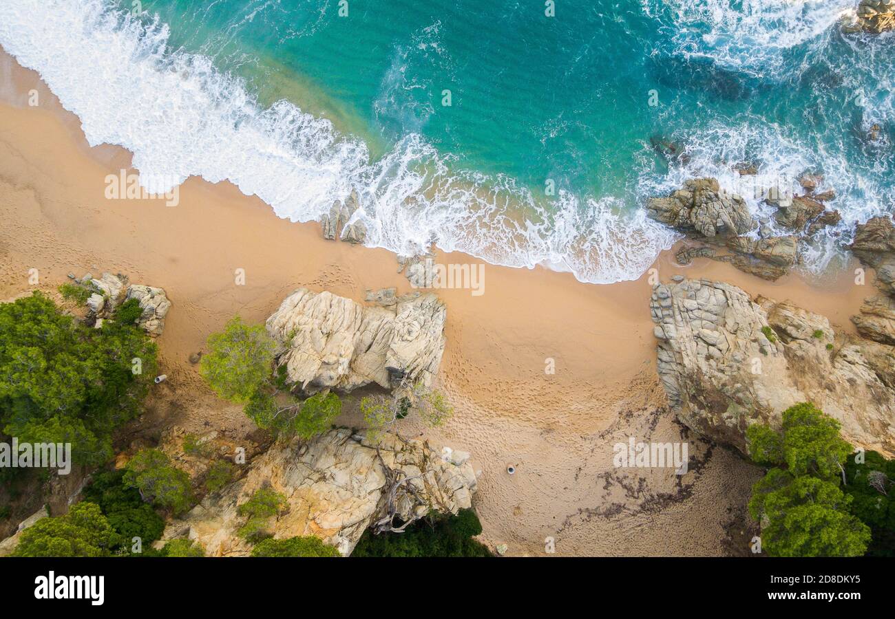 Aerial views of the Costa Brava in Catalonia. Beach full of rocks and ...
