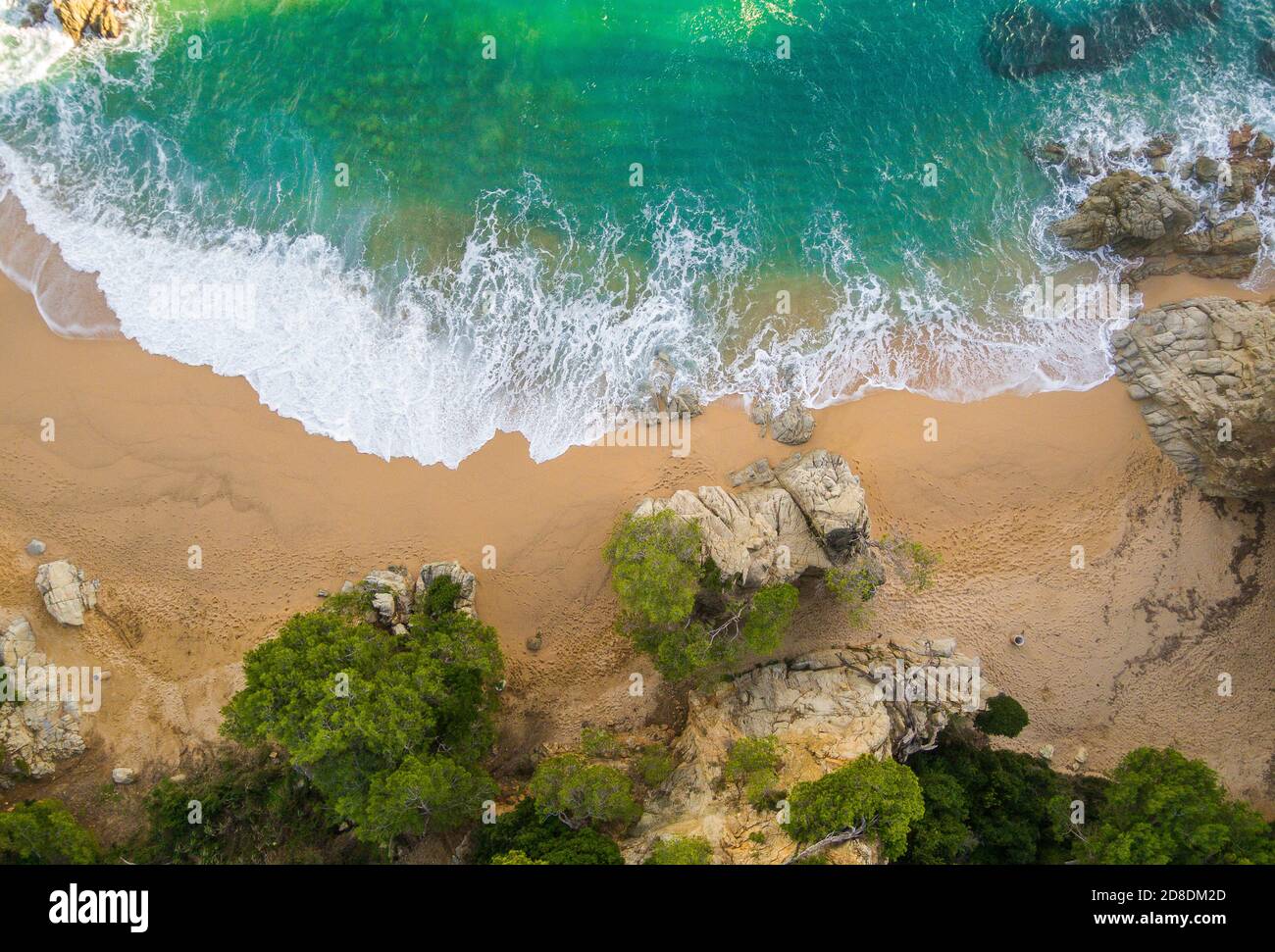 Aerial views of the Costa Brava in Catalonia. Beach full of rocks and ...