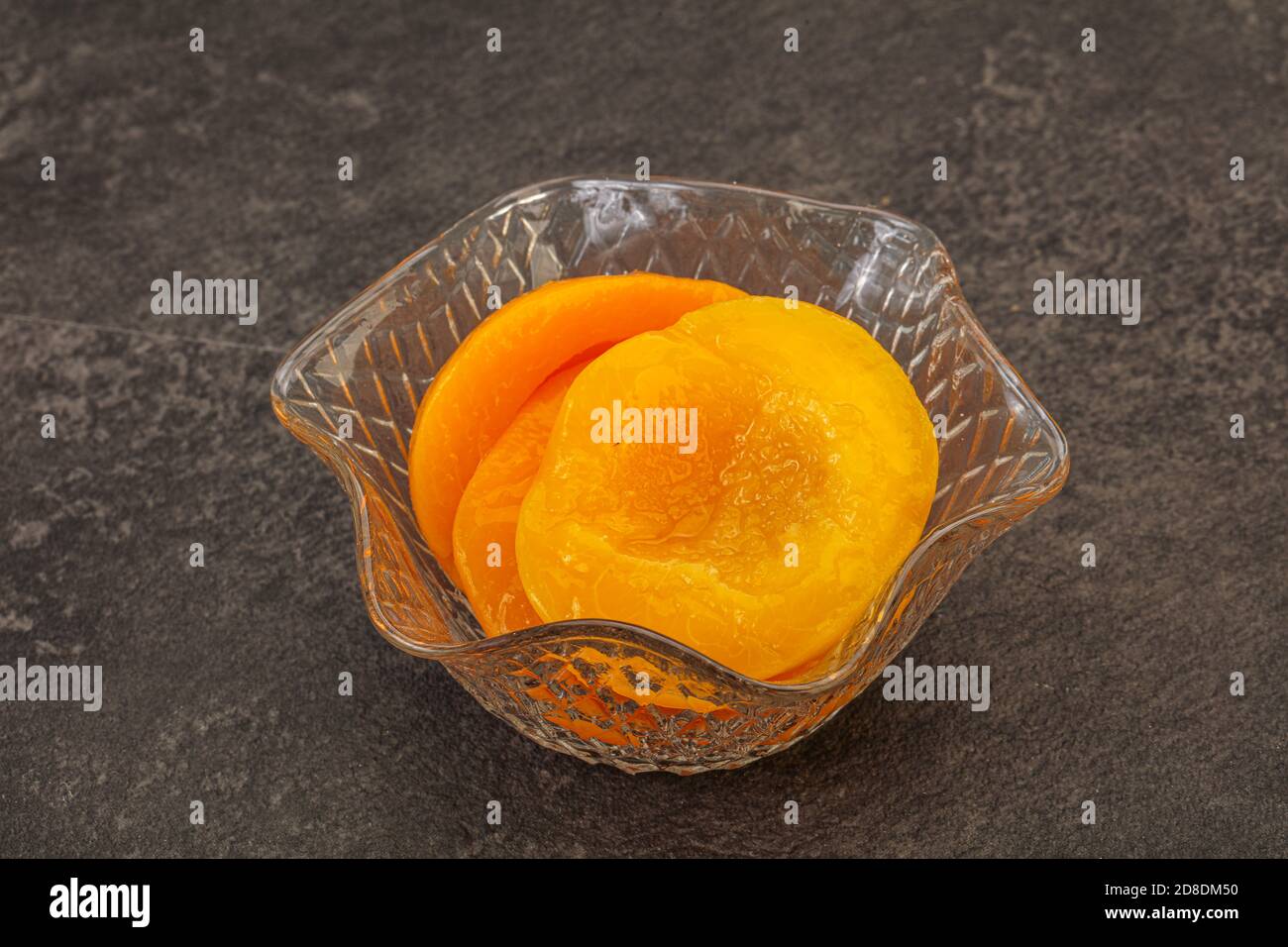 Marinated peaches fruit in the bowl with syrope Stock Photo - Alamy