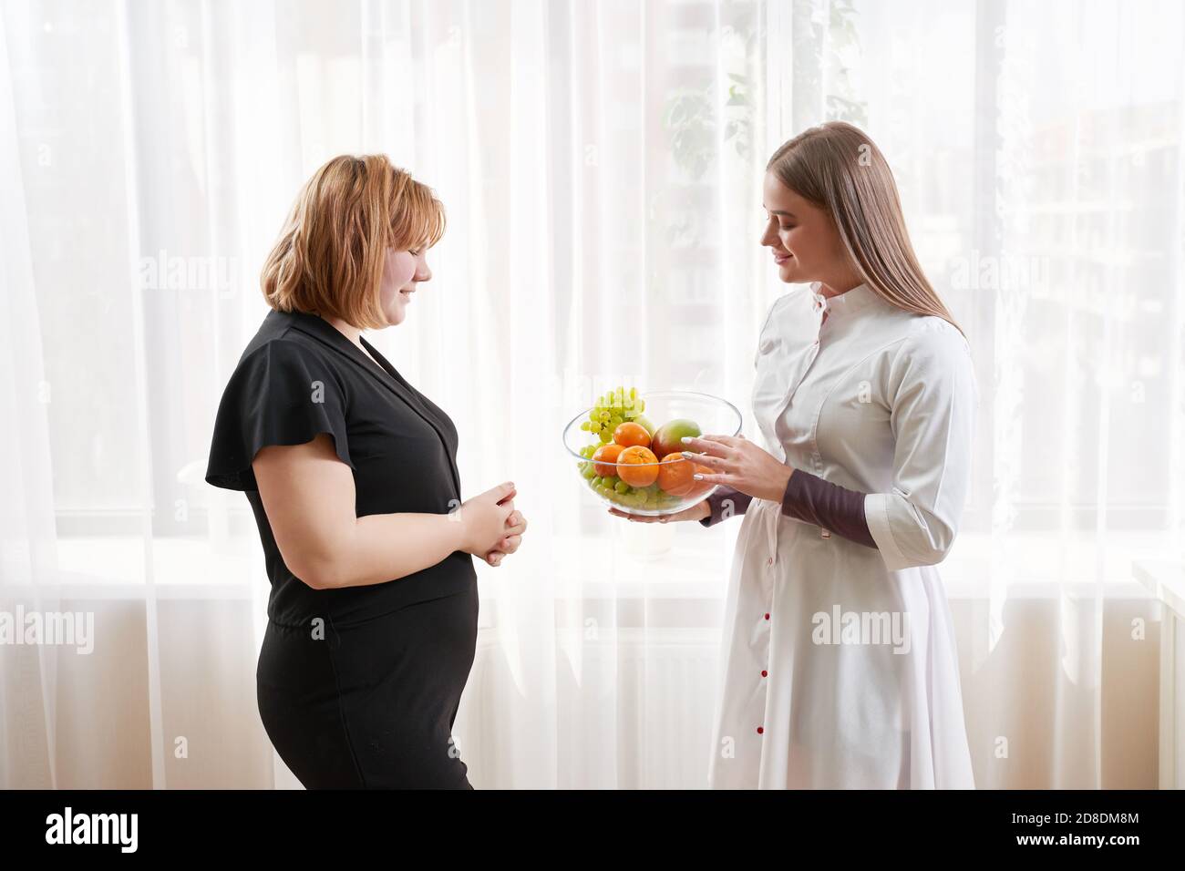 Doctor nutritionist, dietitian and female patient on consultation in ...