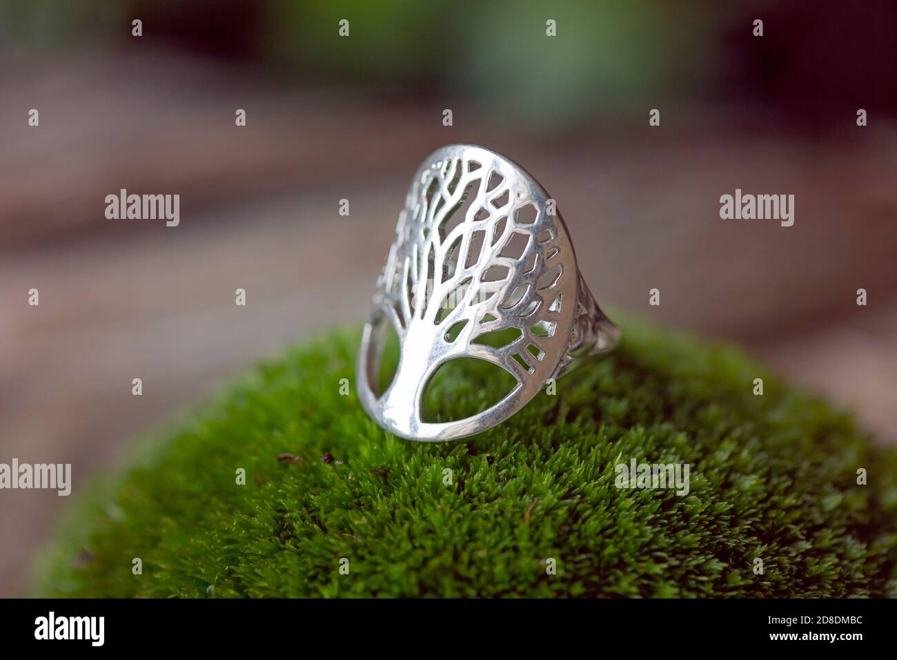 Sterling silver ring in the shape of tree in mandala on green moss ...