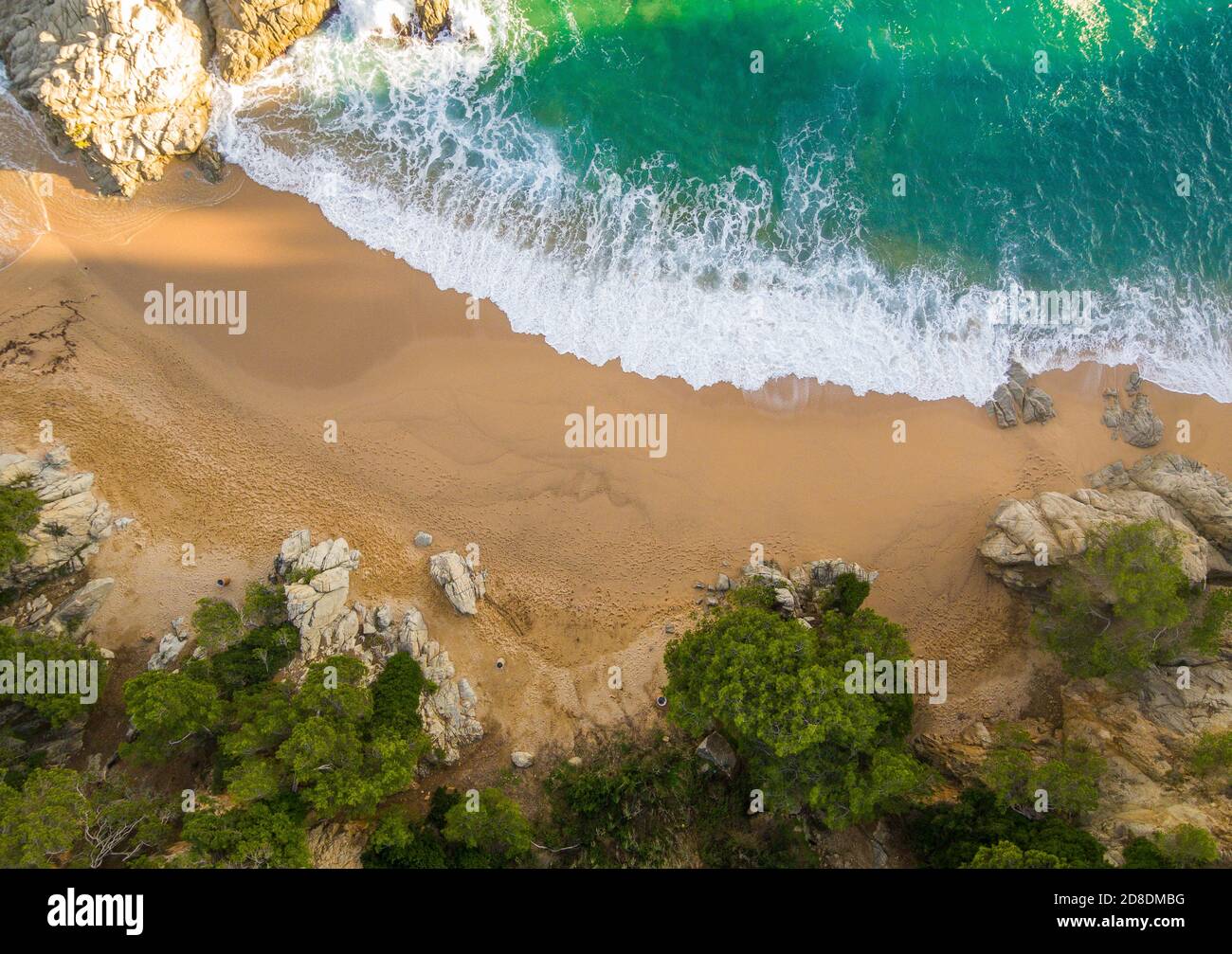 Aerial views of the Costa Brava in Catalonia. Beach full of rocks and ...