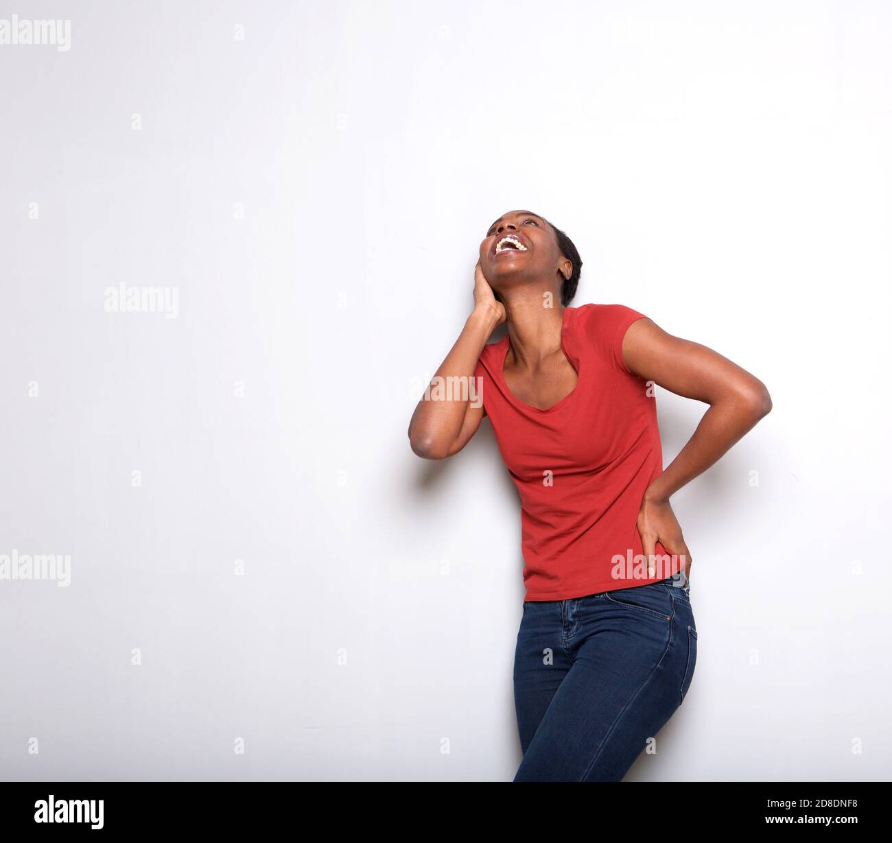 Portrait of beautiful african woman laughing with hand on head Stock ...
