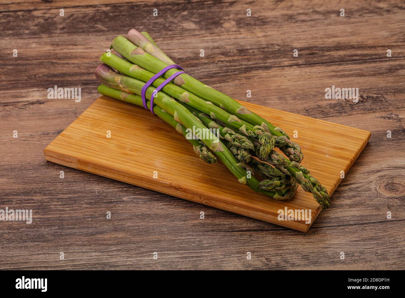 Vegan cuisine - Raw asparagus heap for cooking Stock Photo - Alamy