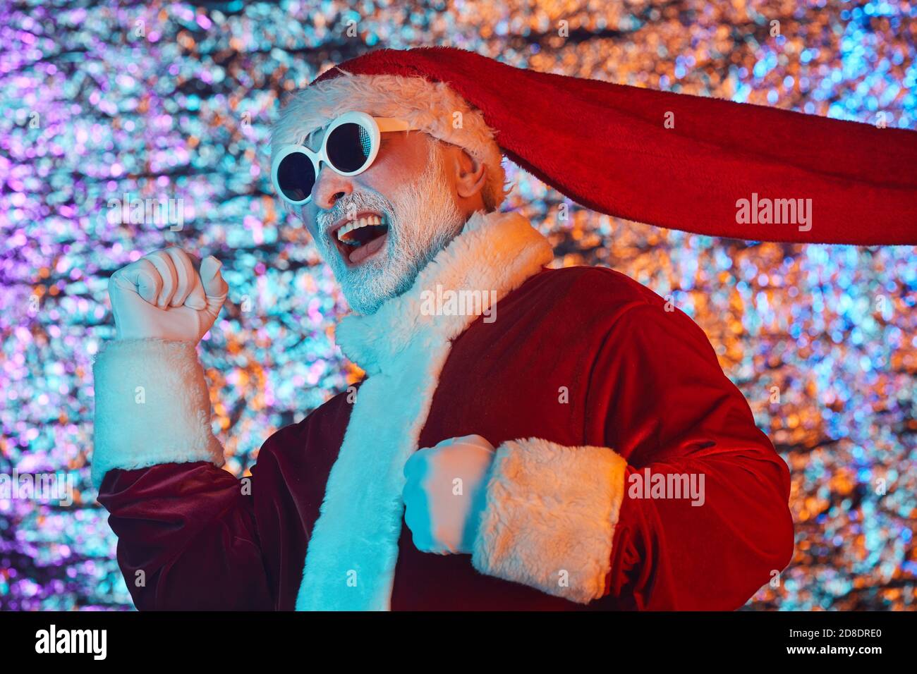 Excited Santa Claus in sunglasses having fun during party Stock Photo ...