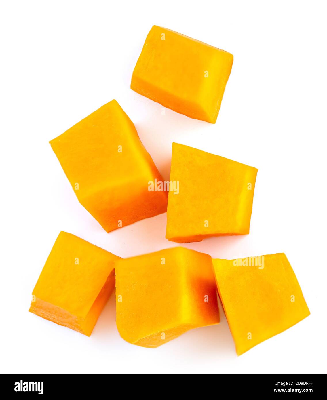 Diced Pumpkin isolated on white background. Fresh Pumpkin pieces cut in ...