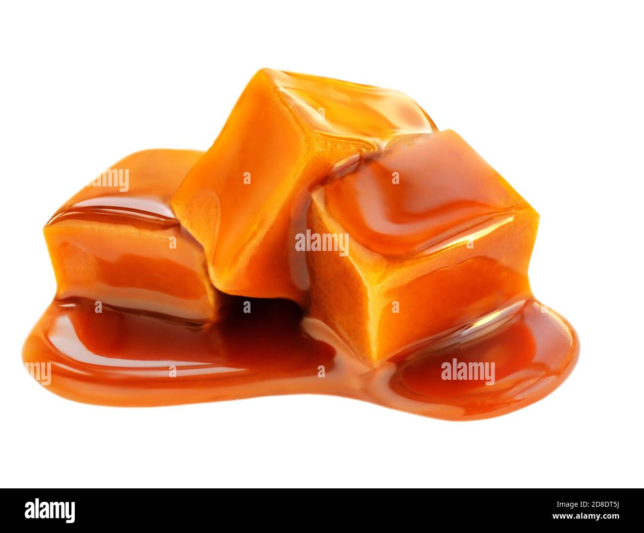 Soft melted caramel isolated on a white background. Flowing toffee ...