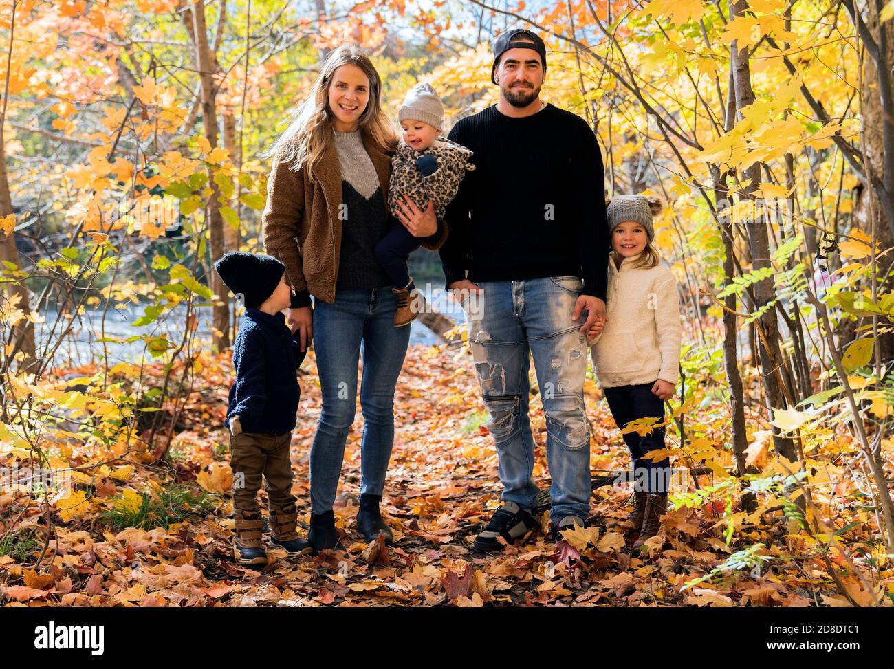 Family Group Relaxing Outdoors In Autumn Landscape Stock Photo - Alamy