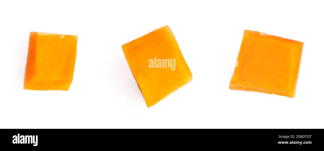 Pumpkin pieces cut in a cube slices isolated on white background ...