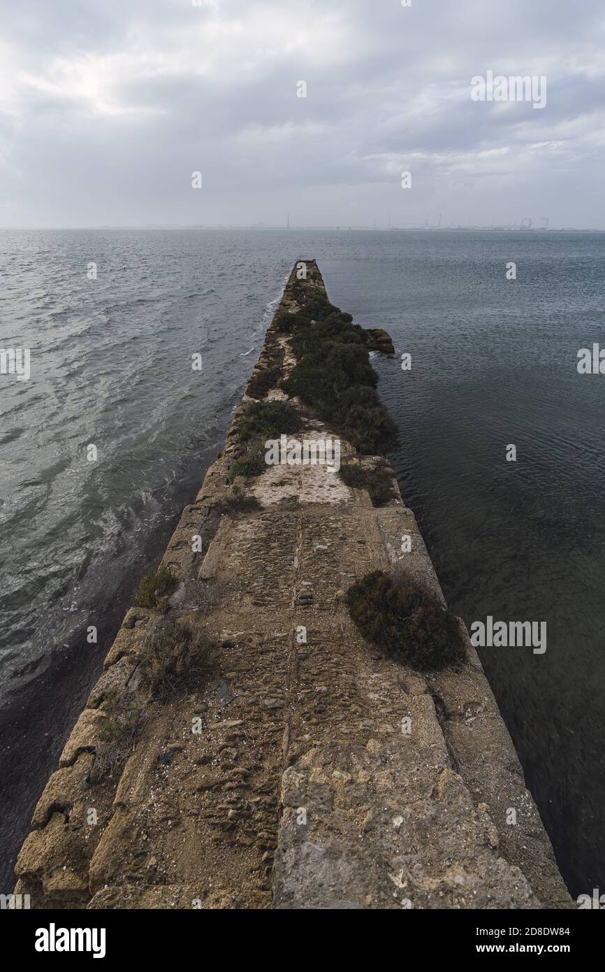 Old long stone path through the ocean Stock Photo - Alamy