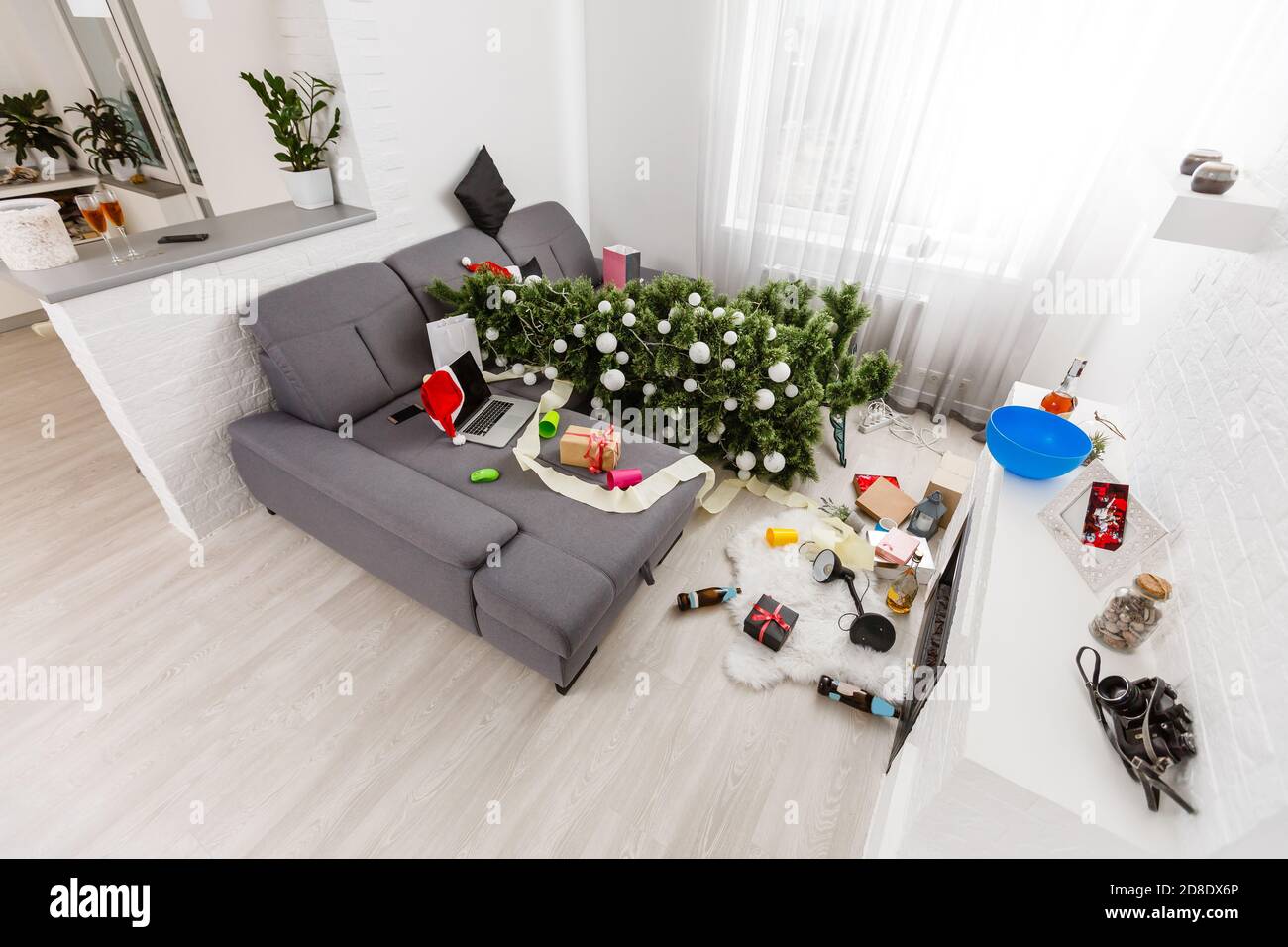 Messy living room interior with Christmas tree. Chaos after party Stock ...