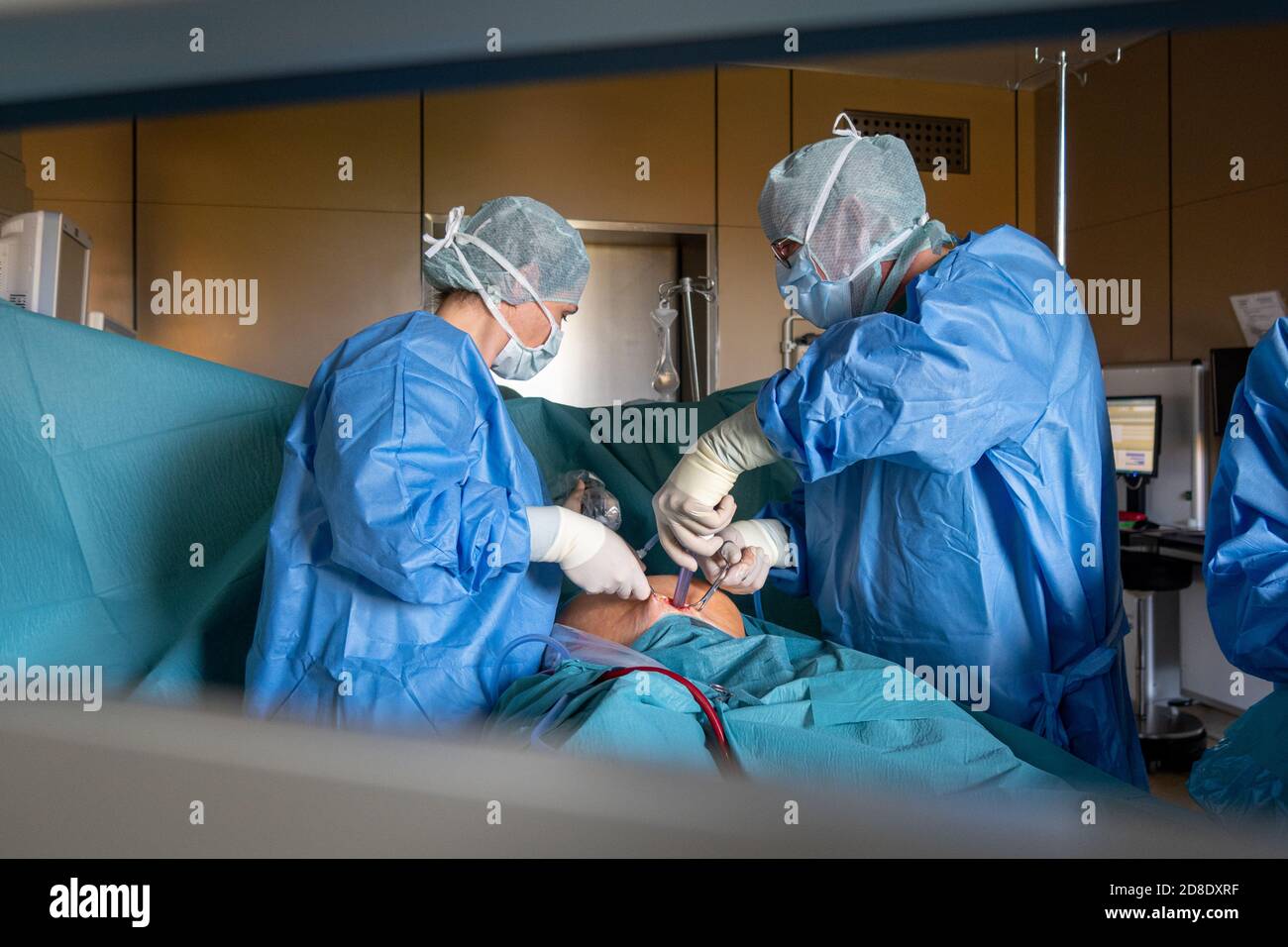 two surgeons perform endoscopic surgery in one operating room Stock ...