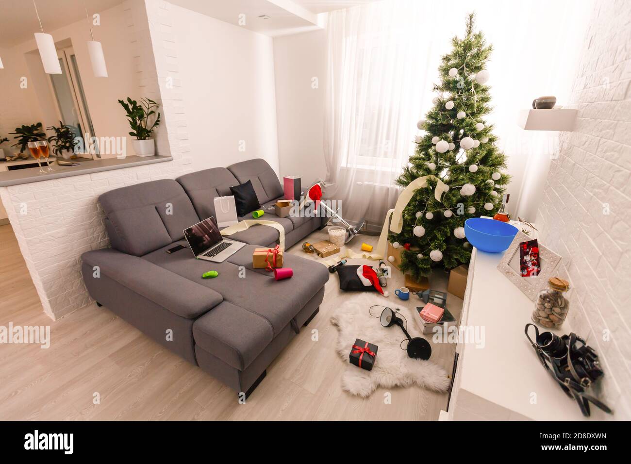 Messy living room interior with Christmas tree. Chaos after party Stock ...