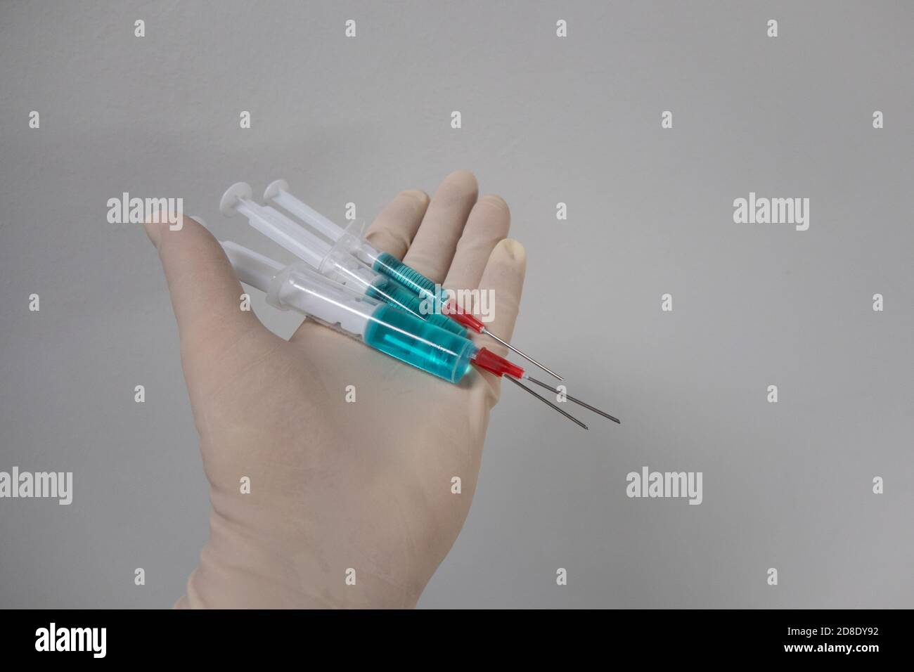 Blue liquid filled syringe in hi-res stock photography and images - Alamy
