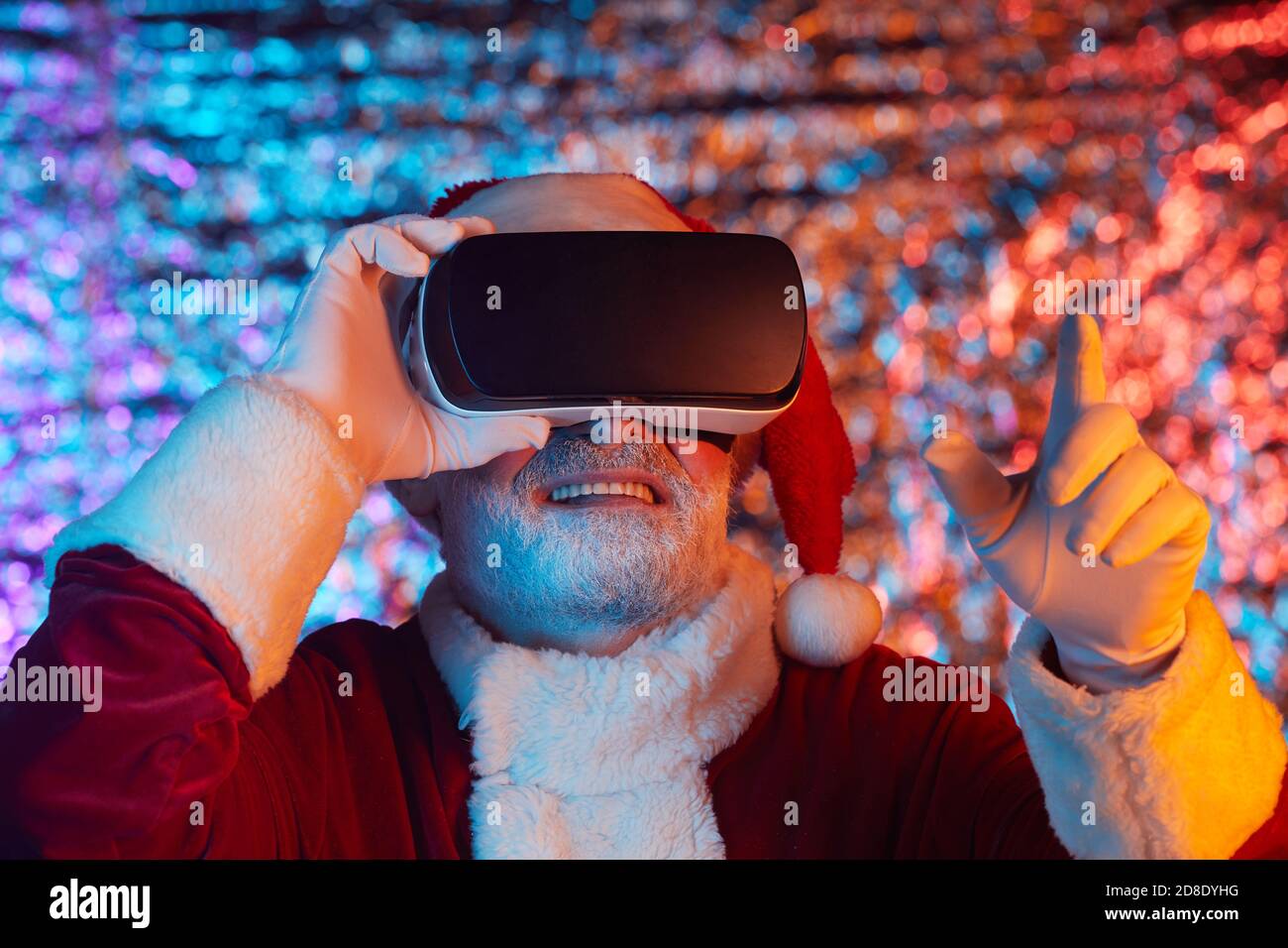 Santa Claus in VR glasses gesturing he playing in video game Stock ...