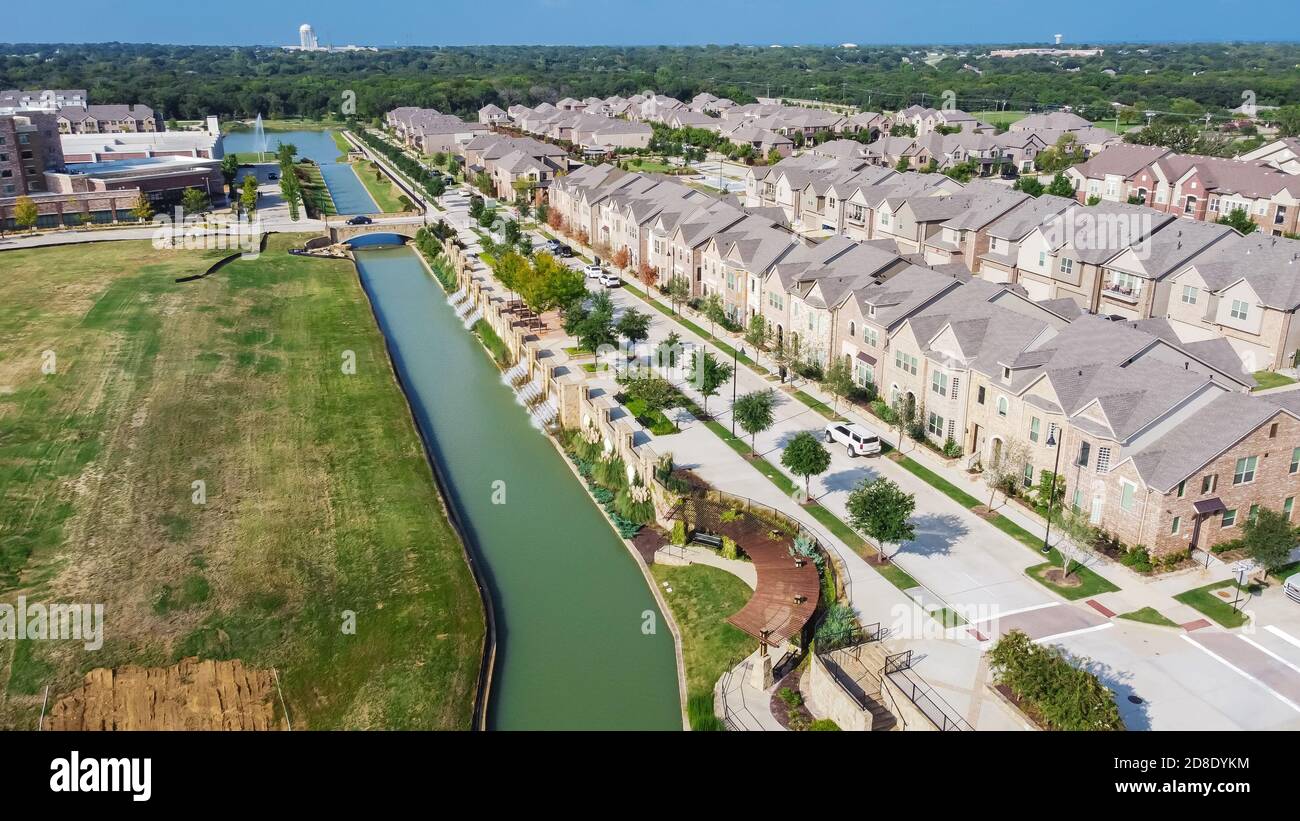 Top view new development riverside residential and commercial neighborhood with vacant land in ...