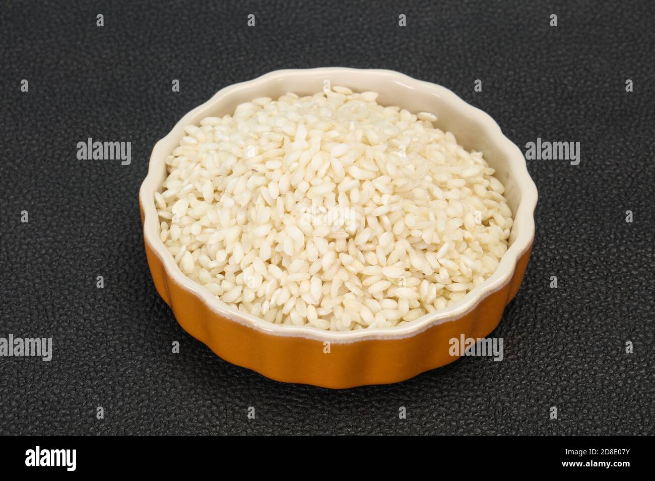 Raw Arborio rice for Italian risotto Stock Photo - Alamy