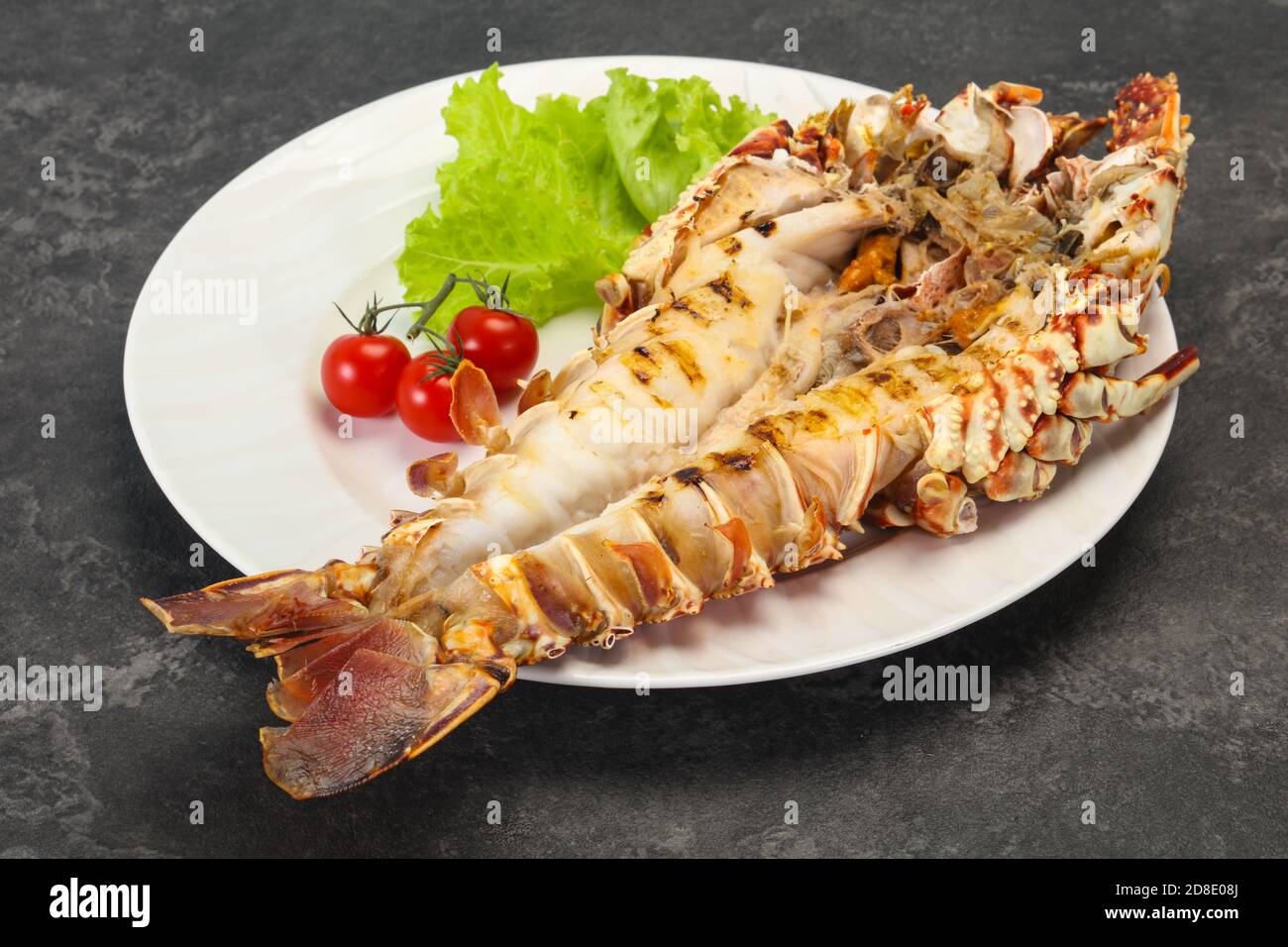 Grilled crayfish in the plate served salad Stock Photo - Alamy