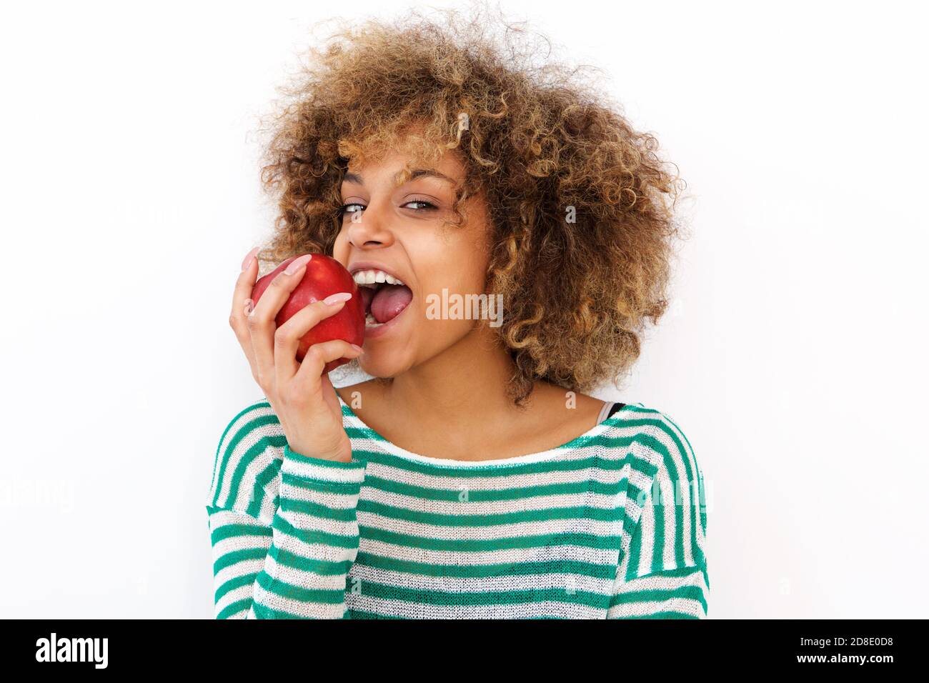 Portrait of healthy young african american woman eating an apple Stock ...