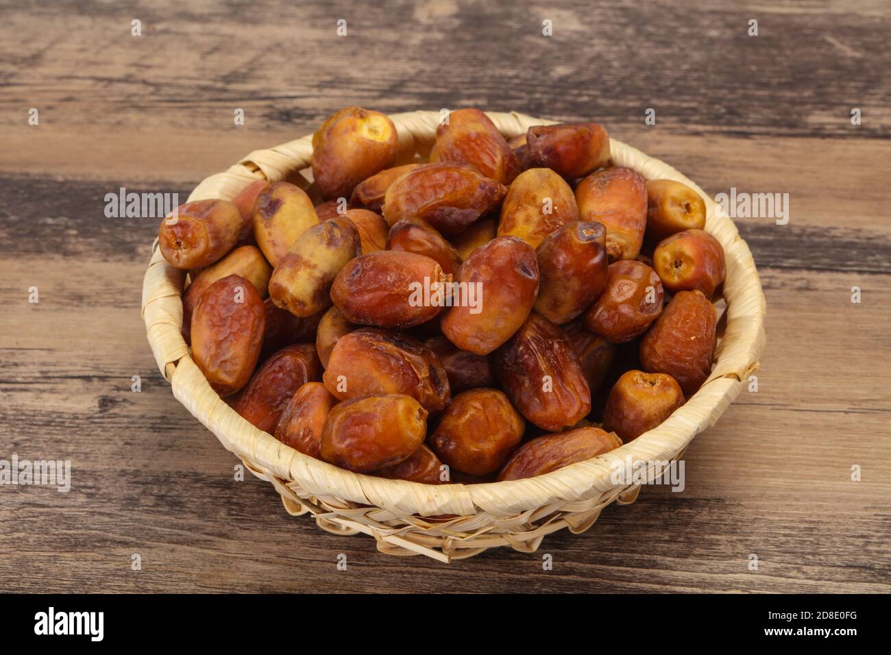 Sweet tasty dry dates dessert in the basket Stock Photo - Alamy