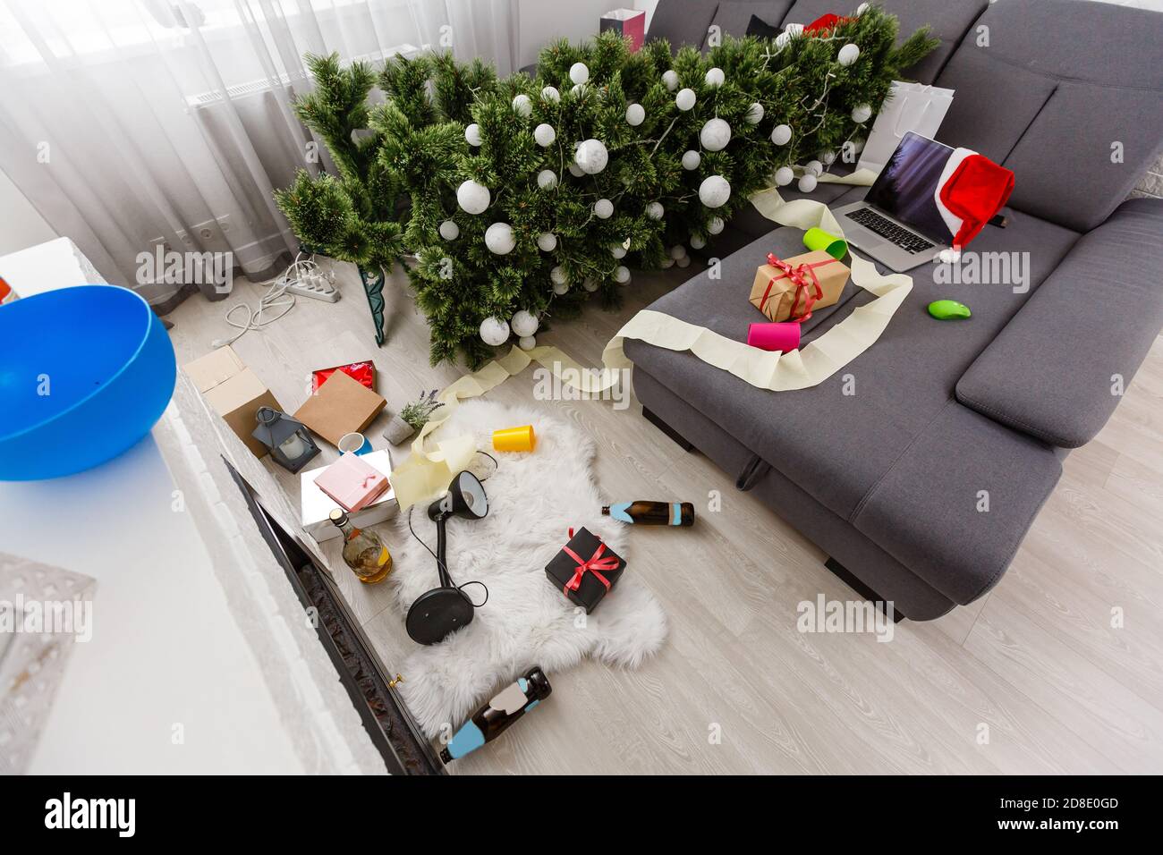 Messy living room interior with Christmas tree. Chaos after party Stock ...