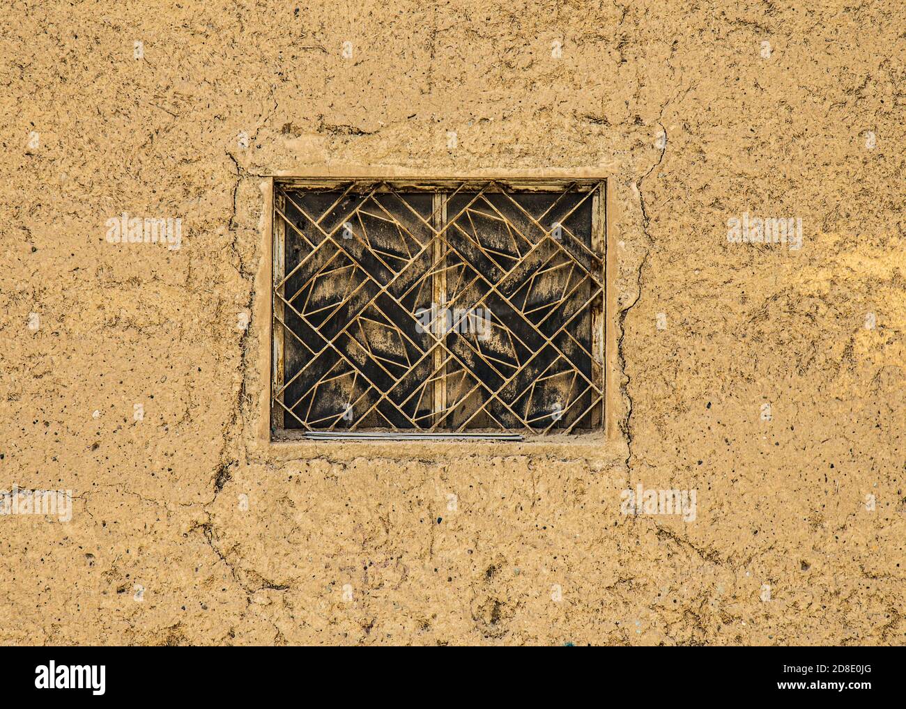 old metal window on a clay wall Stock Photo - Alamy