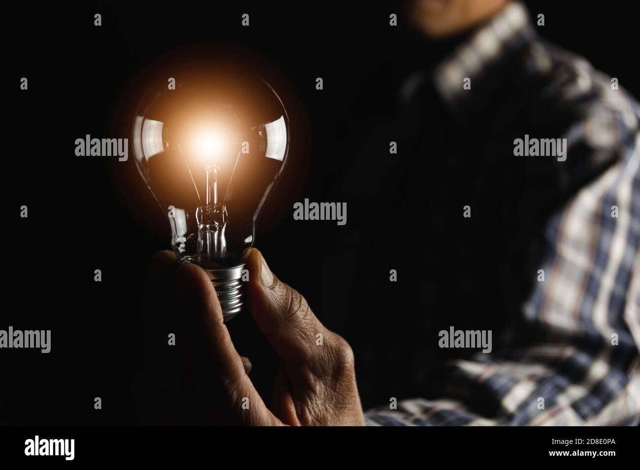 Hand holding a light bulb. Innovation and creative concept Stock Photo ...