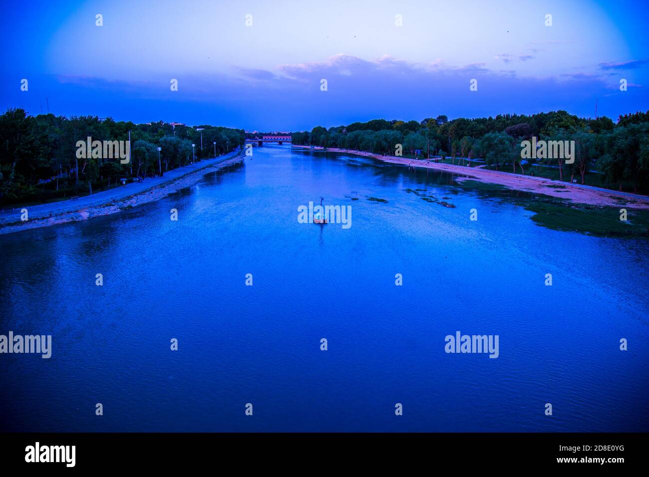 a swan boat floating on the Zayande-rud river in Isfahan Stock Photo ...