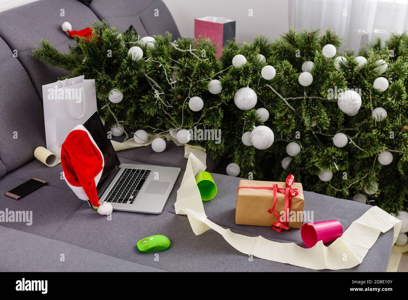 Messy living room interior with Christmas tree. Chaos after party Stock ...