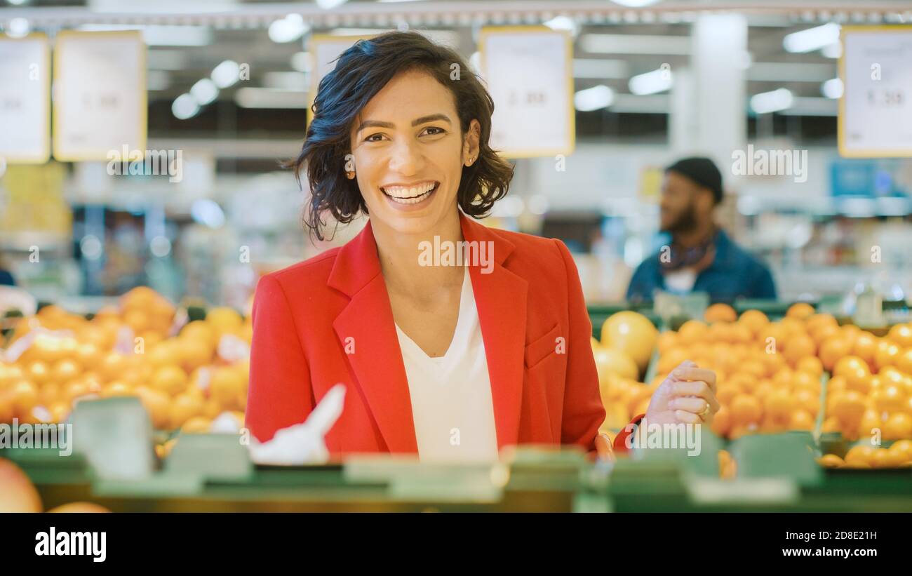 At the Supermarket: Portrait of the Beautiful Smiling into Camera Woman ...
